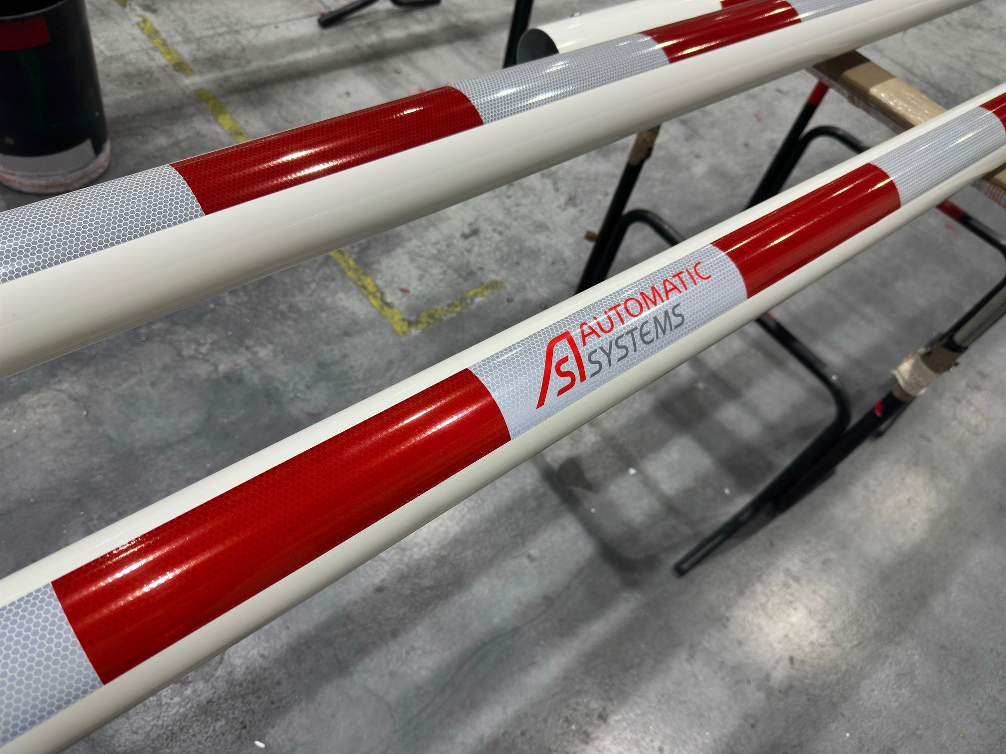 Enhanced reflective stickers of the arms of automatic barriers